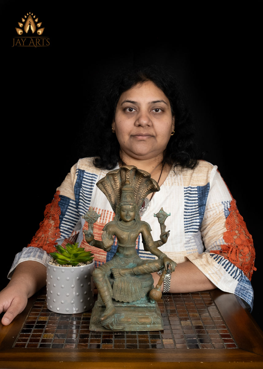 12" Lord Vishnu seated on Sesha in a Majestic Pose Meticulously Hand C – JayArts.com